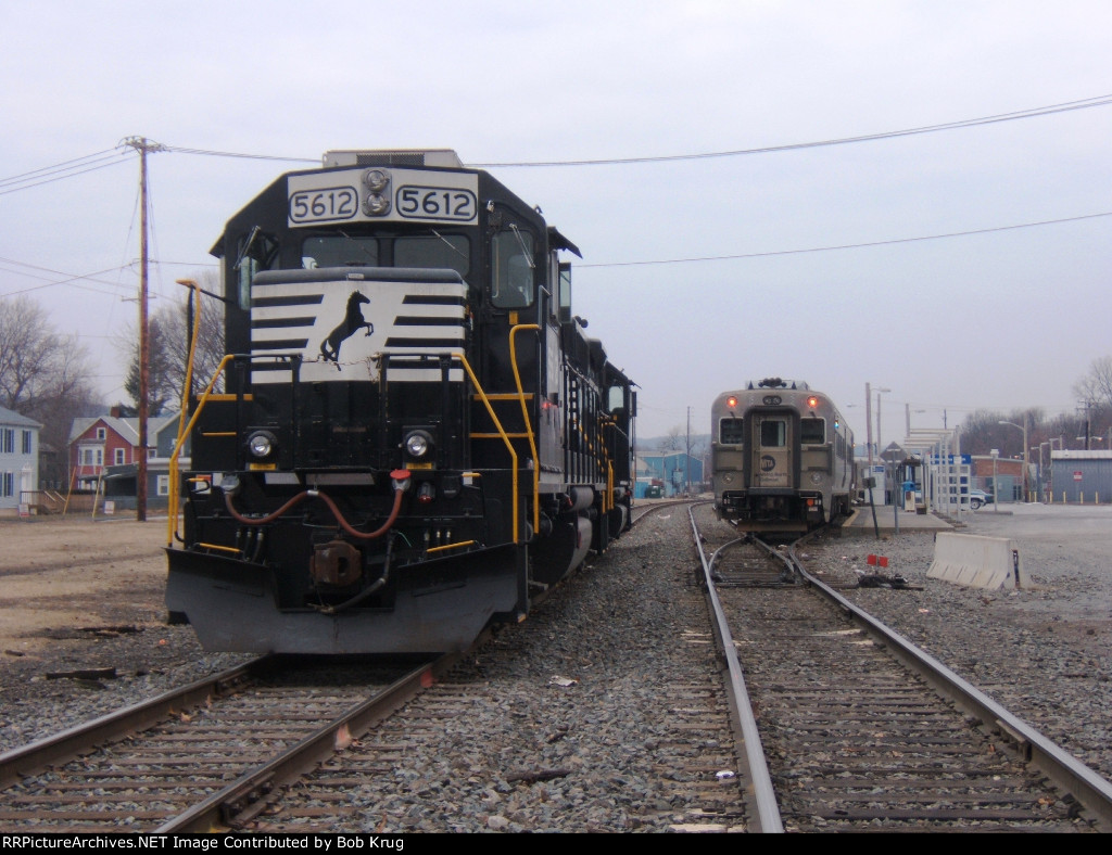 NS 5612 rolling westbound past Metro North commuter train